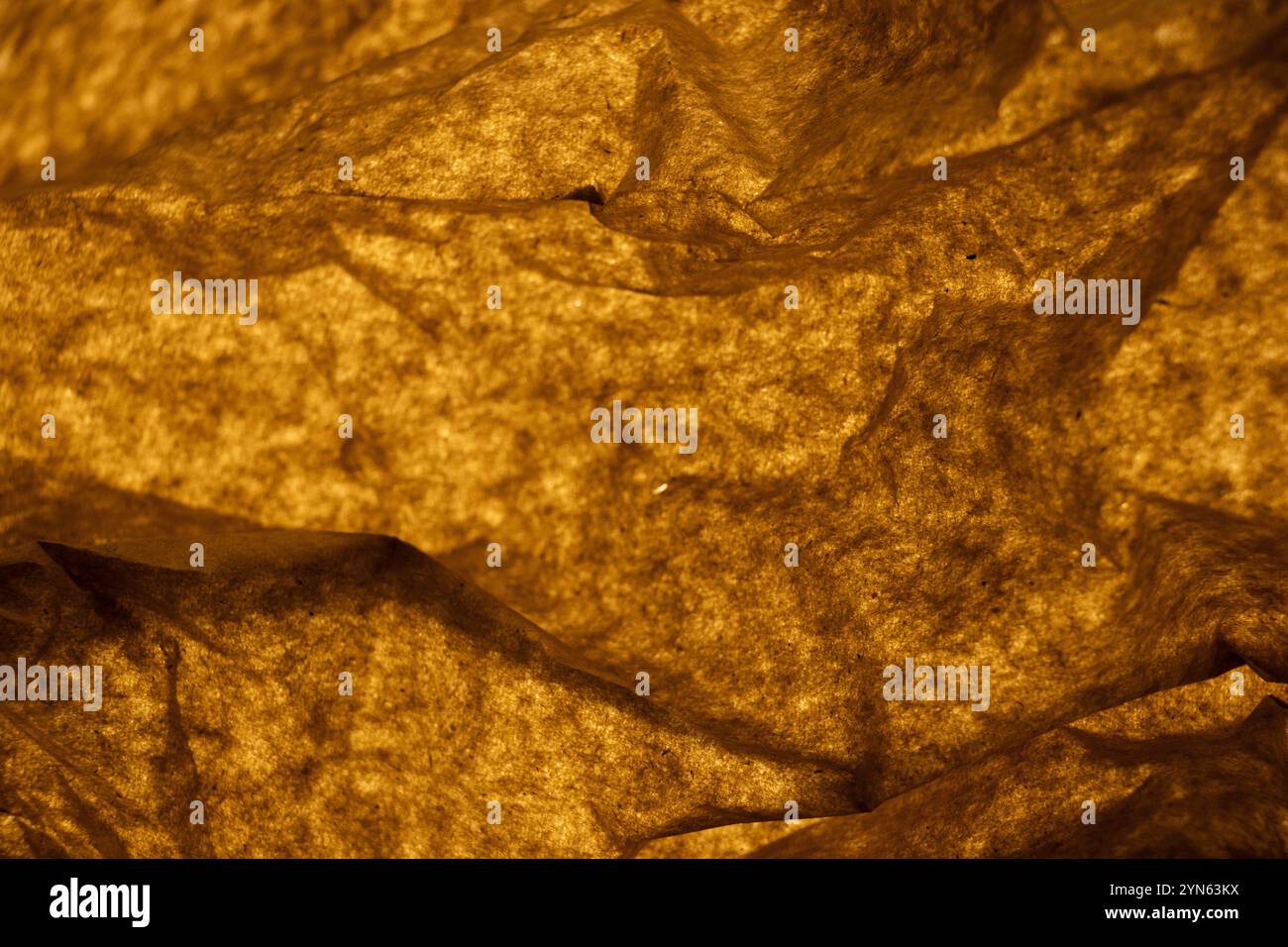 Brown paper wrinkled as a background in the light, paper background ...