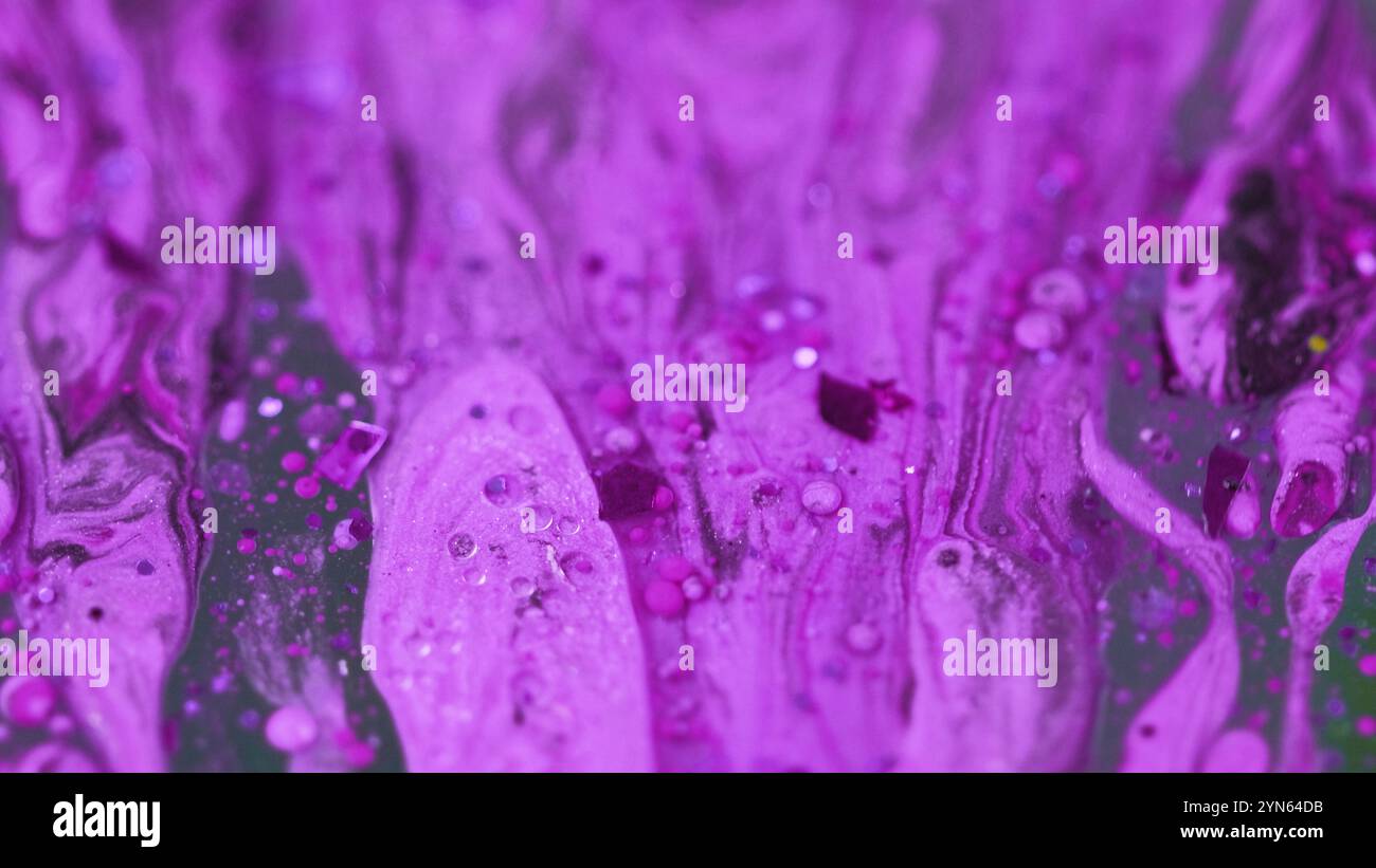 Paint drip. Glitter fluid flow. Defocused purple color shimmering ...