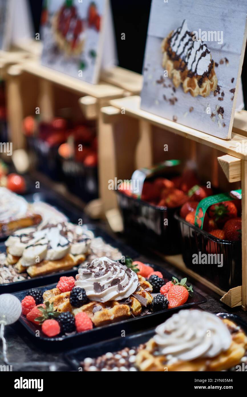 Fresh Belgian waffles on display in a shop window in the centre of ...