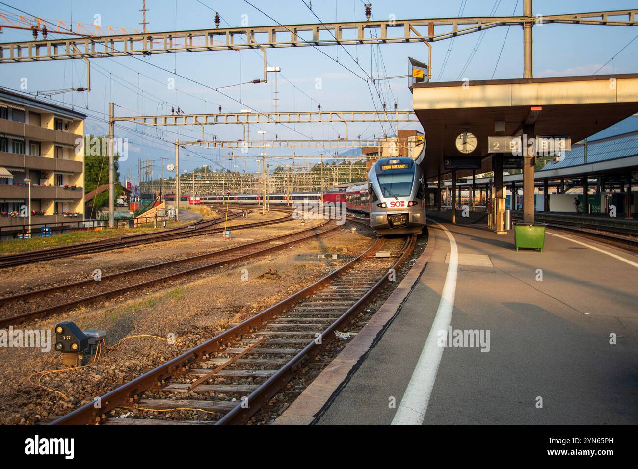 trains at a swiss train station Stock Photo - Alamy