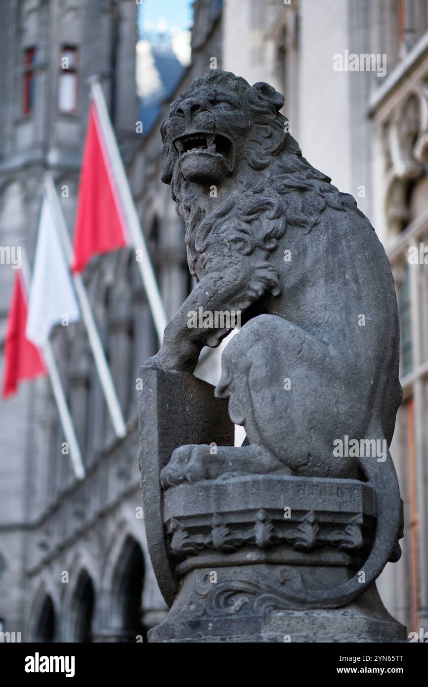 Statue of a lion holding the Bruges coat of arms in the Big Market in ...