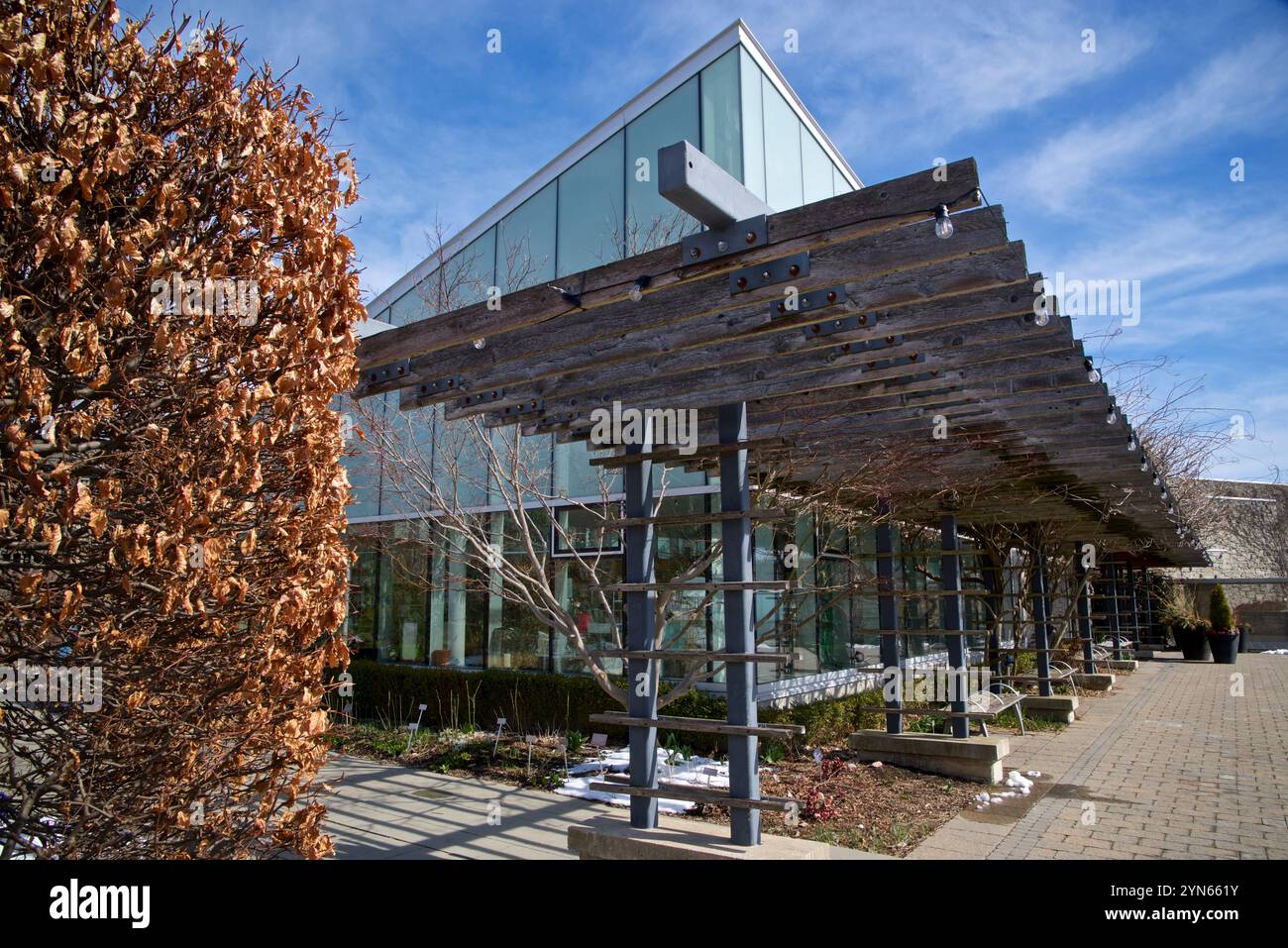 Modern design building exterior with a canopy and blue sky background ...