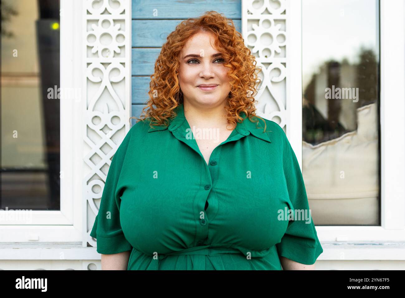 Portrait Plus Size Curvy Woman with Curly Red Hair and Full Bust in ...