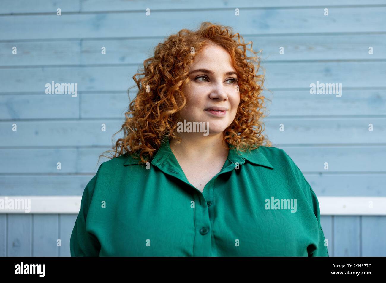 Portrait Plus Size Curvy Woman with Curly Red Hair in Green Clothing ...