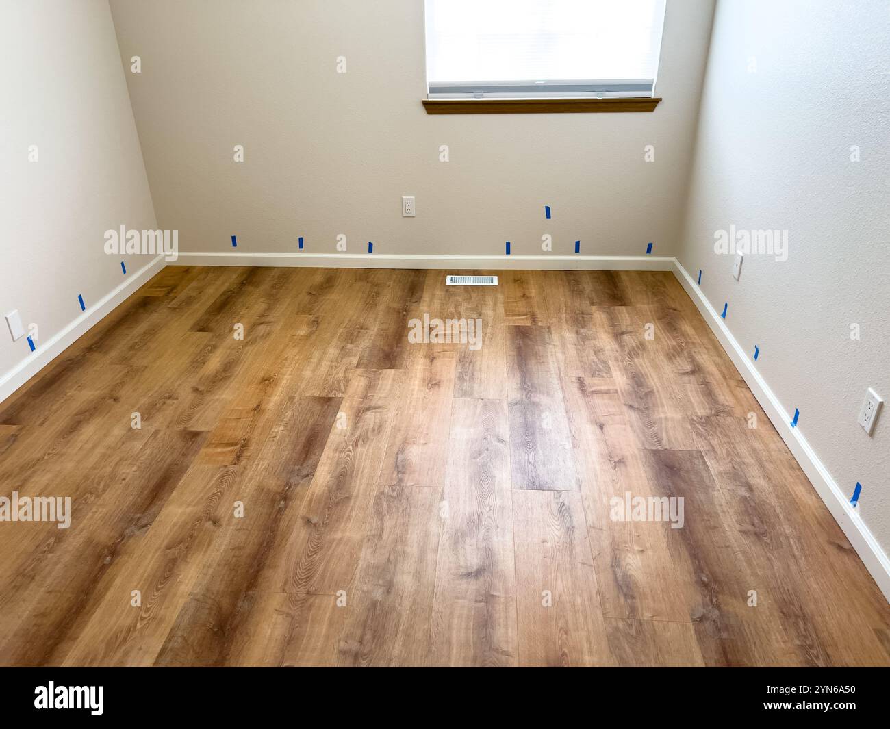 Vinyl Plank Flooring Installation with Baseboards Stock Photo - Alamy