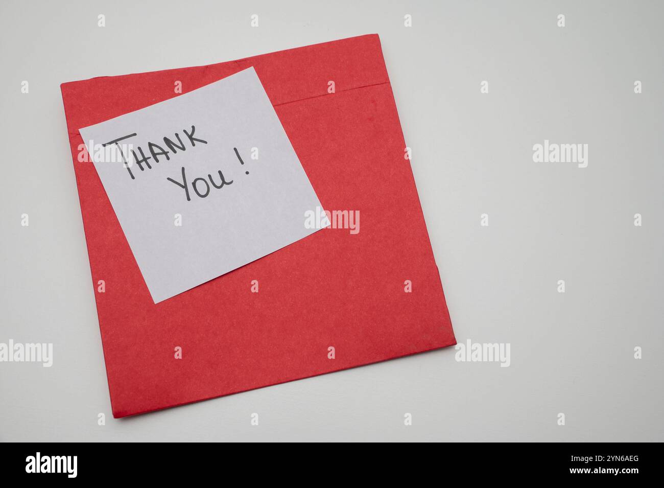 Words thank you written on sticky note Stock Photo - Alamy
