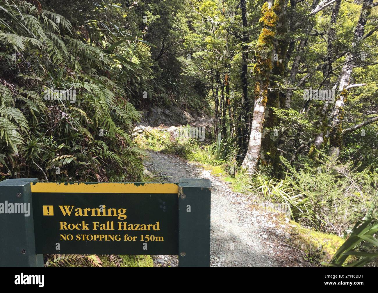 Warning sign about falling rock at famous Routeburn Track, South Island ...