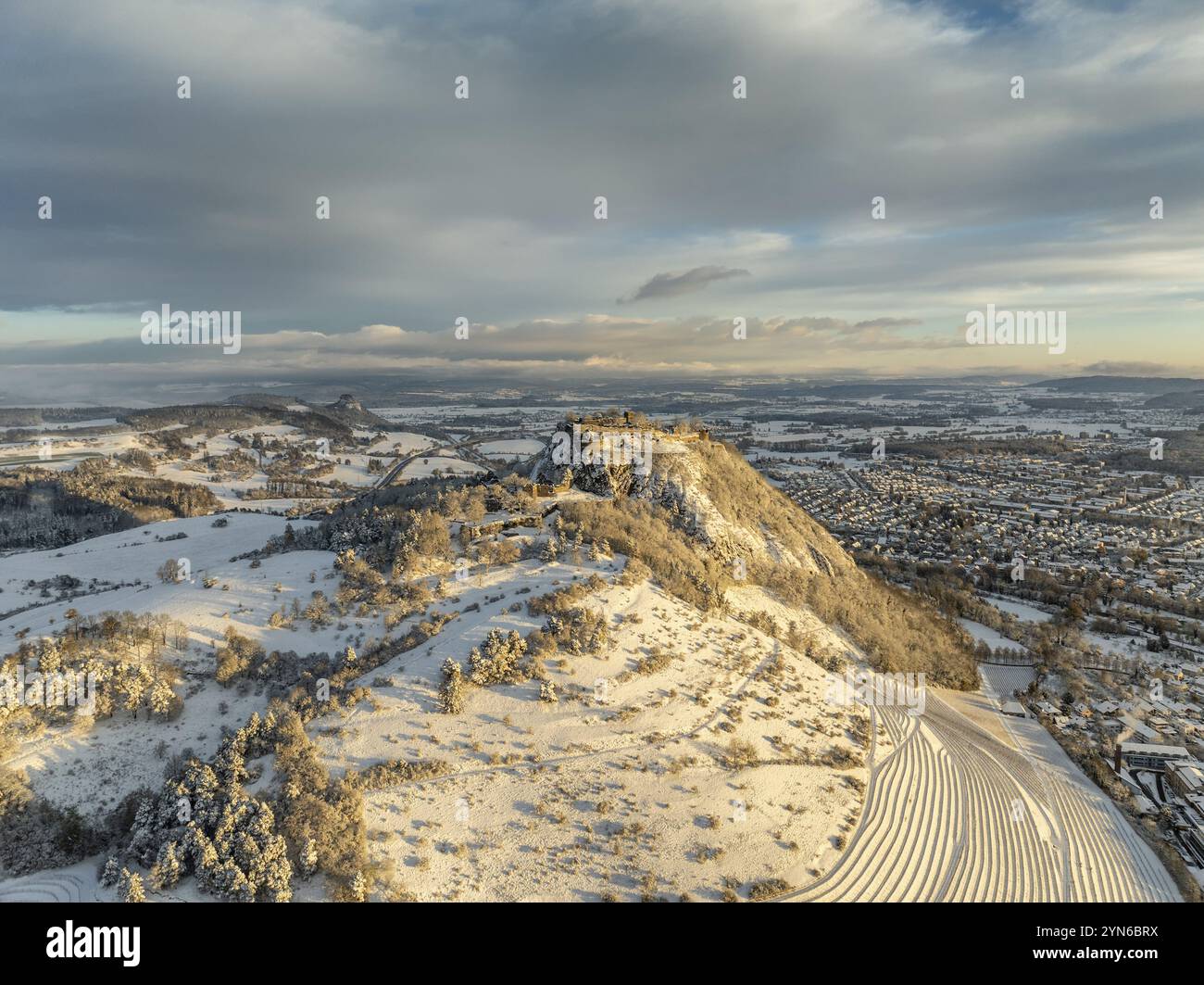 Aerial view of the snow-covered Hegau volcano Hohentwiel with Germany's ...