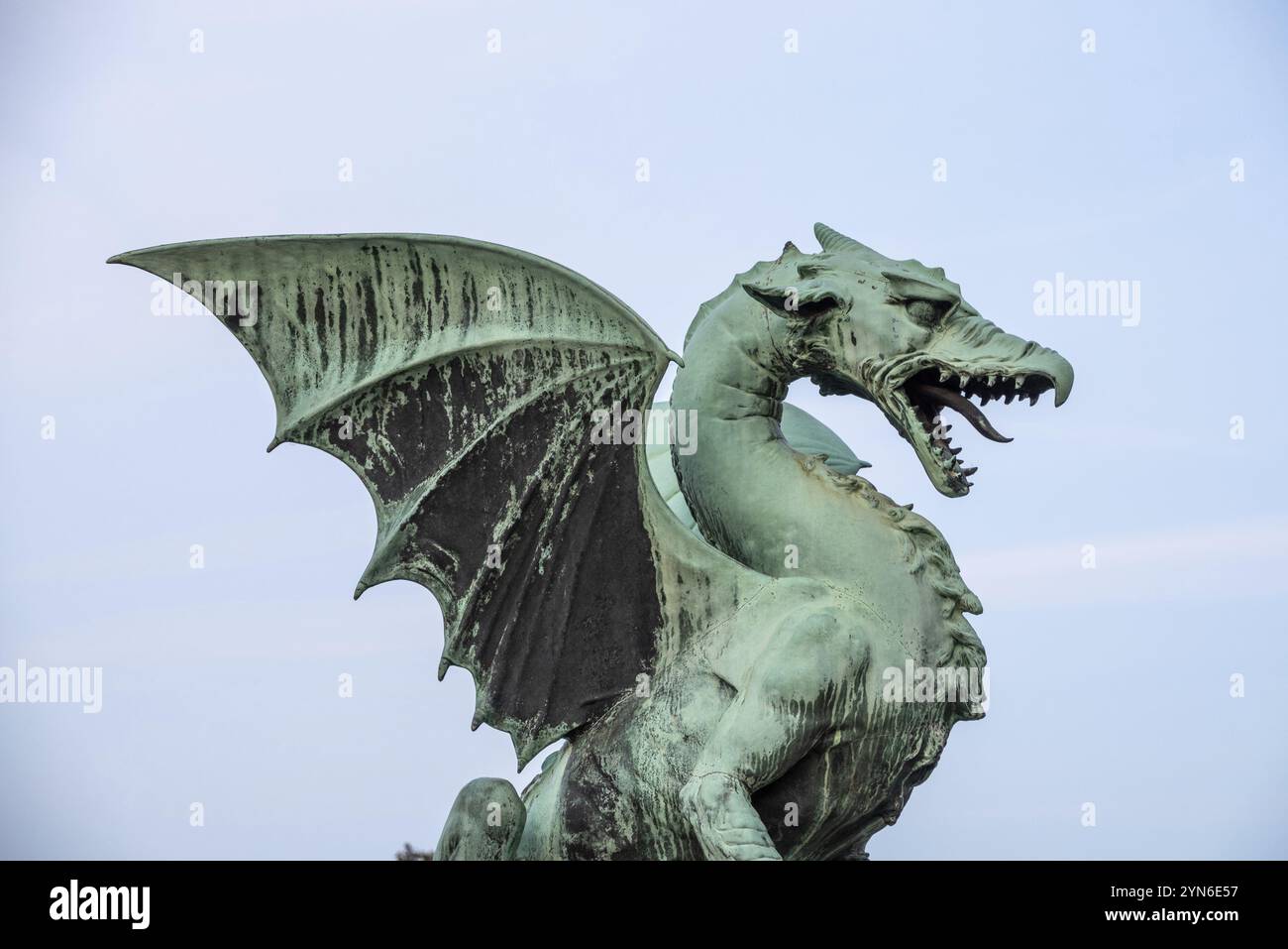 A dragon statue on the Dragon Bridge, symbol of the city of Ljubljana ...