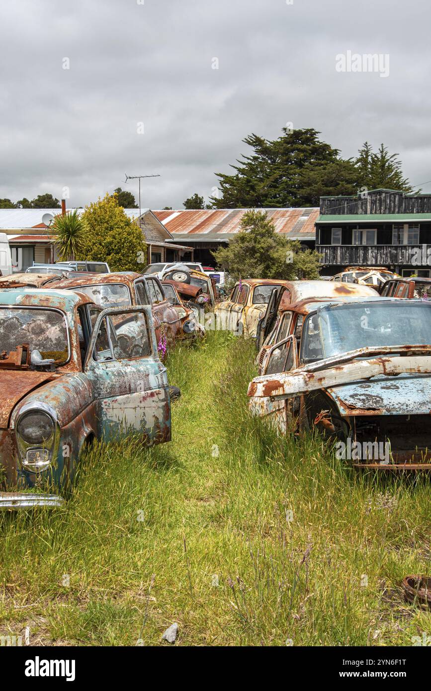 Antique cars on a big scrapyard at the end of Old Coach Road Trail ...
