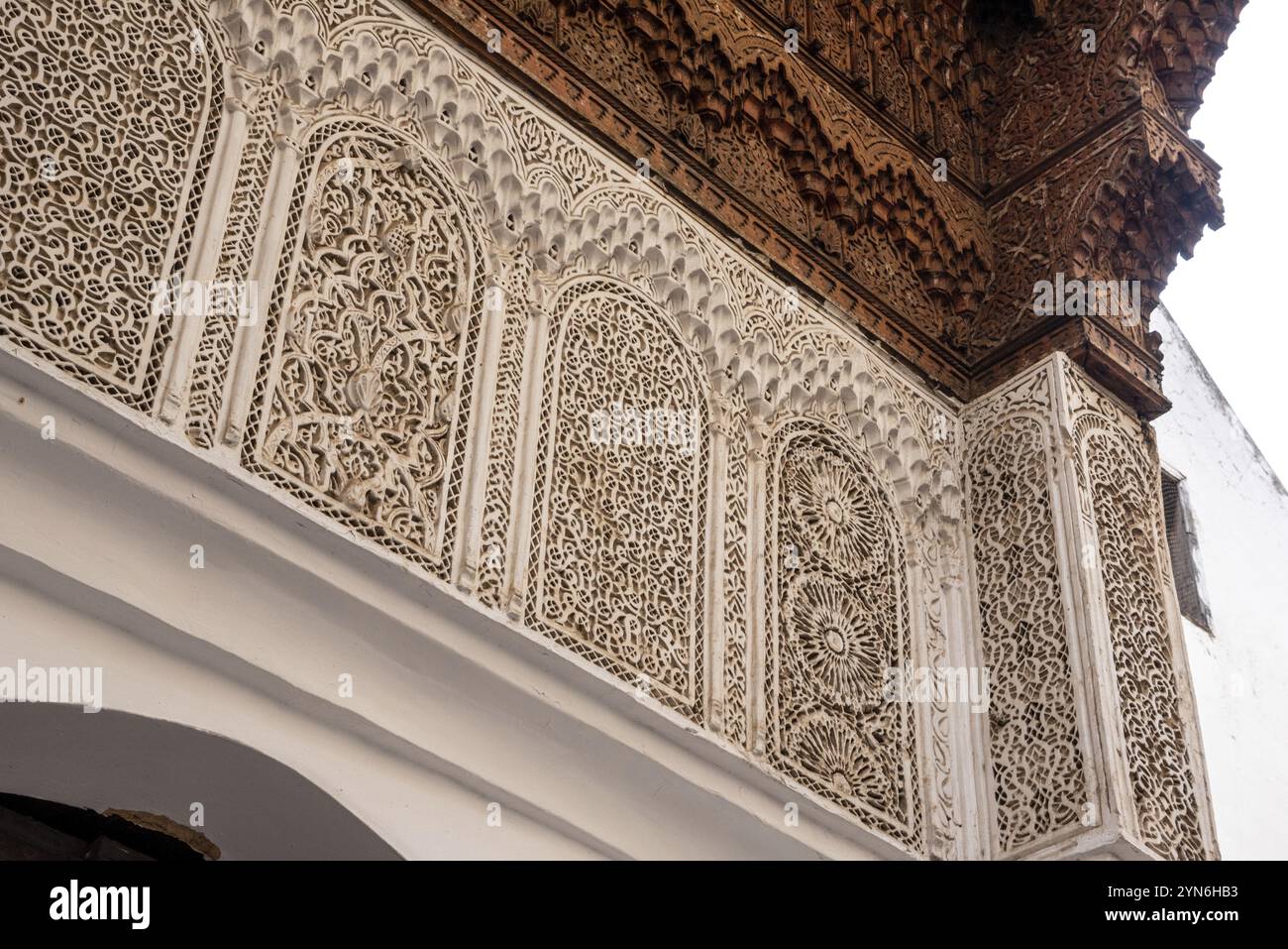 Beautiful ornate relief at a facade of a madrasa in Fes, a Koran school ...