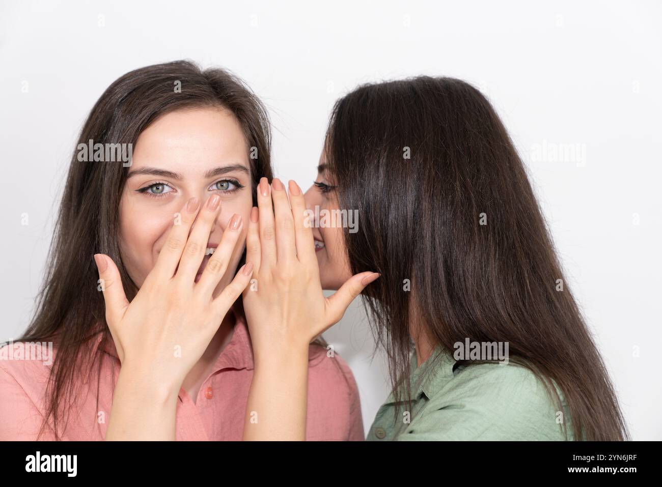 Two young women gossip hi-res stock photography and images - Alamy