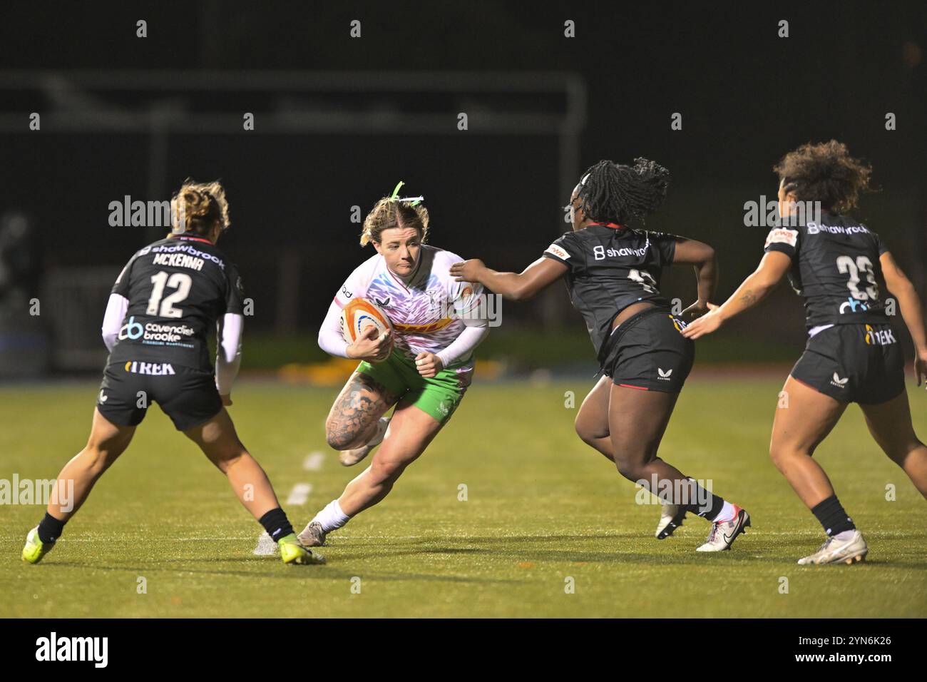 Beth Wilcock of Harlequins Women drives forward with the ball during ...