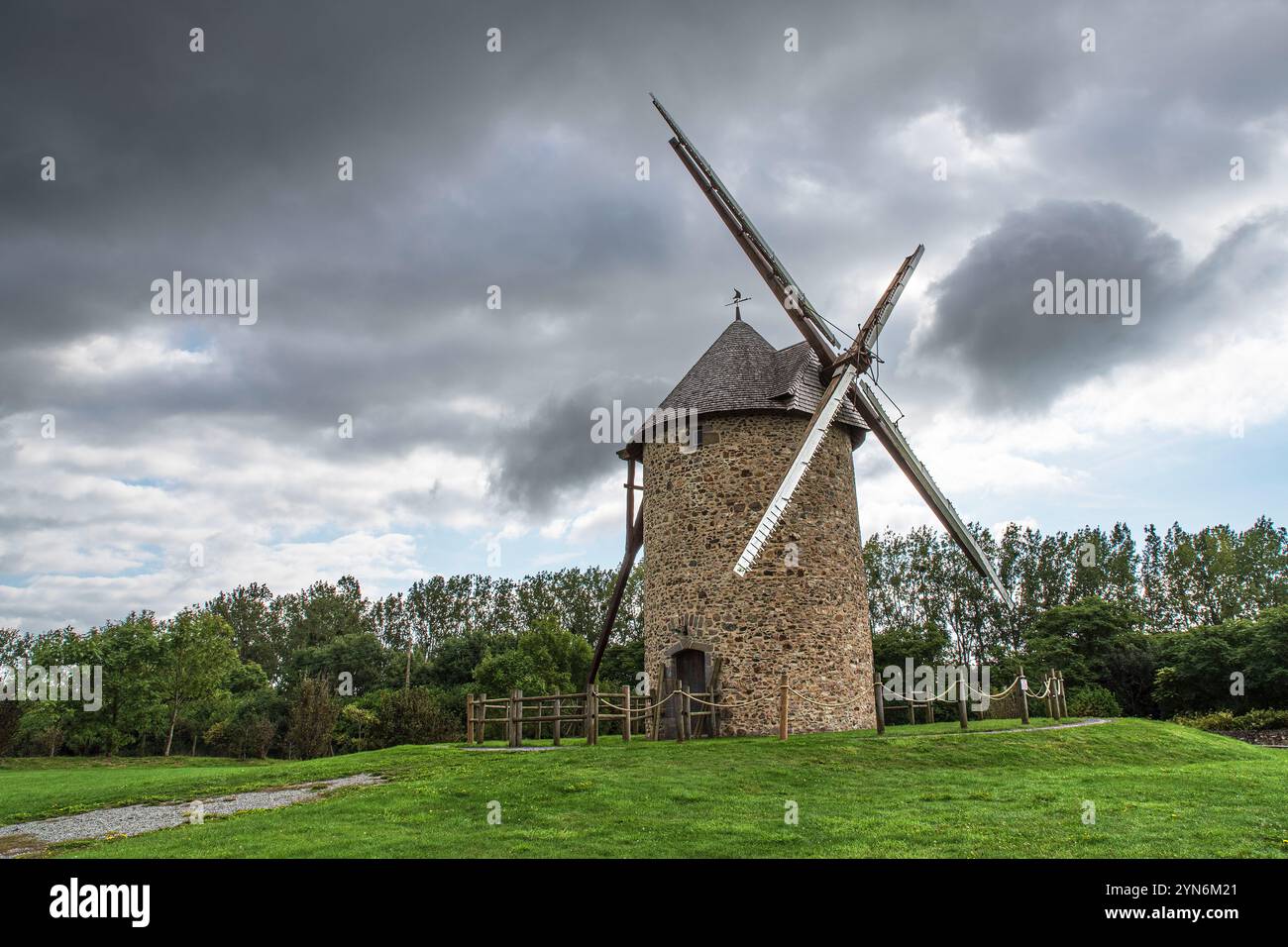 Old stone windmill in the town of Gouville-sur-mer in Normandy, France ...