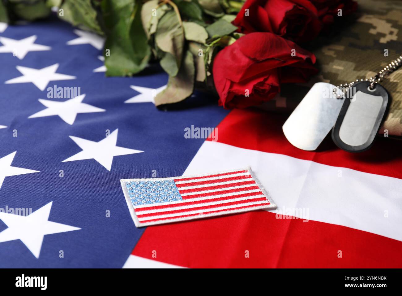 Veterans day. USA army patch, tokens, American flag, roses and military ...
