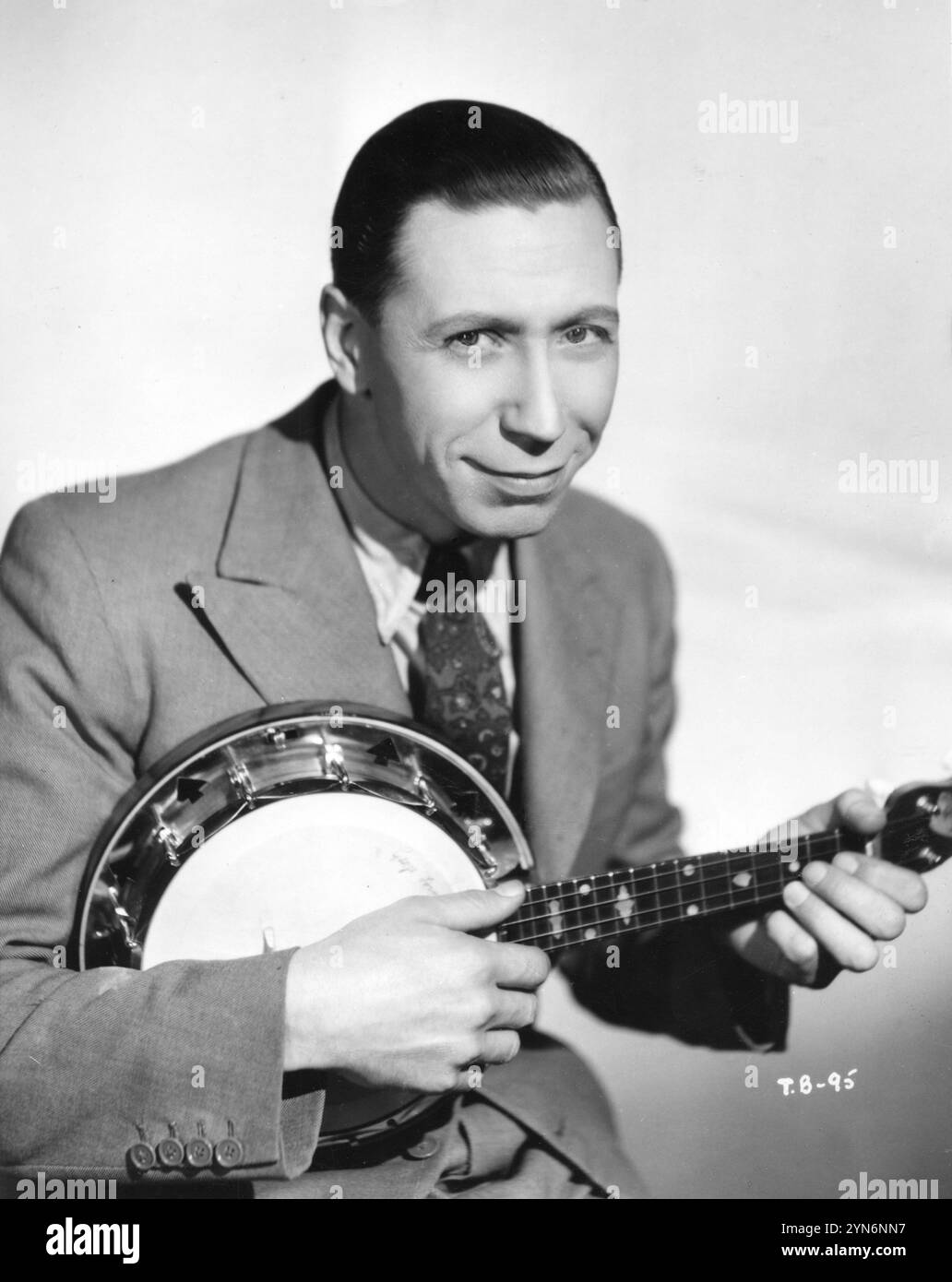 A Portrait of British Film Comedian GEORGE FORMBY playing his ukelele ...
