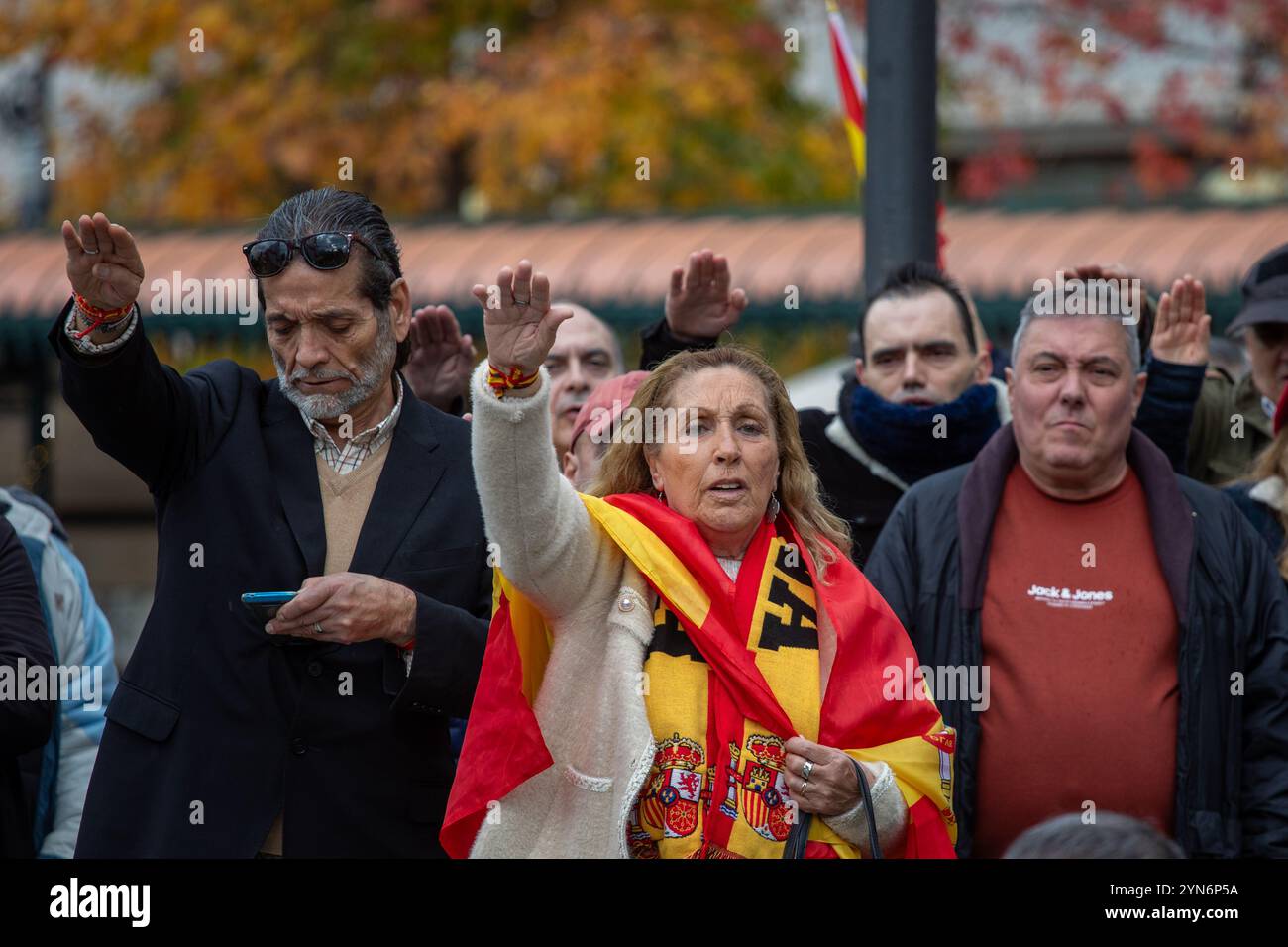 Madrid, Spain. 24th Nov, 2024. A group of far-right protesters perform ...