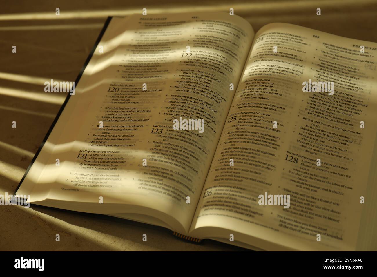 Open Holy Bible in English language on table Stock Photo - Alamy