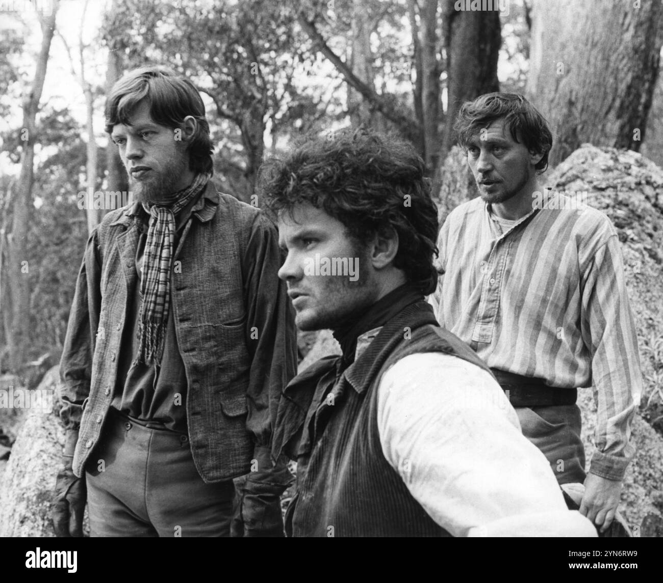 MICK JAGGER, ALLEN BICKFORD and MARK McMANUS in a scene from NED KELLY 1970 Director TONY ...