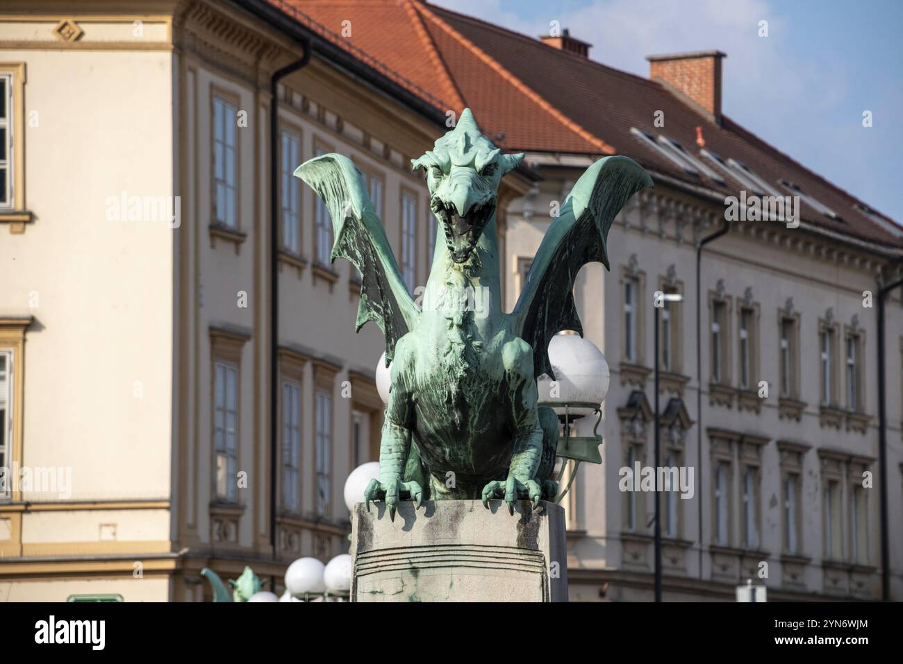 A dragon statue on the Dragon Bridge, symbol of the city of Ljubljana ...