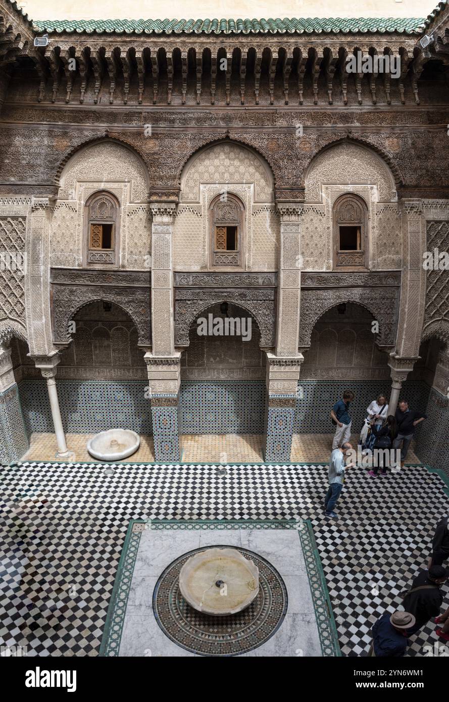 Fes, Morocco, April 04, 2023, Rich decorated facade in the courtyard of ...