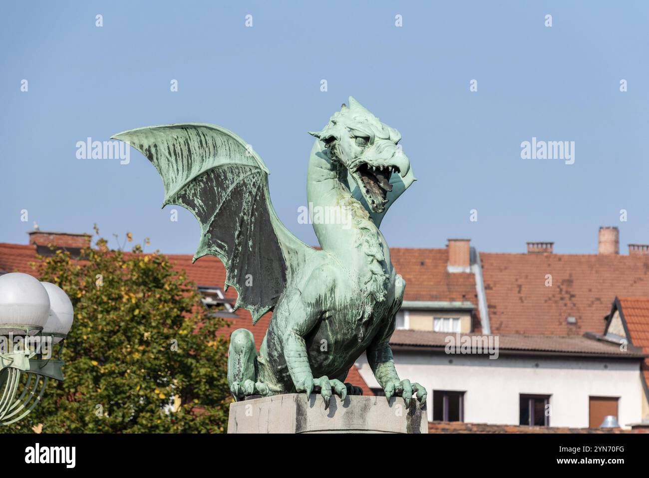 A dragon statue on the Dragon Bridge, symbol of the city of Ljubljana ...