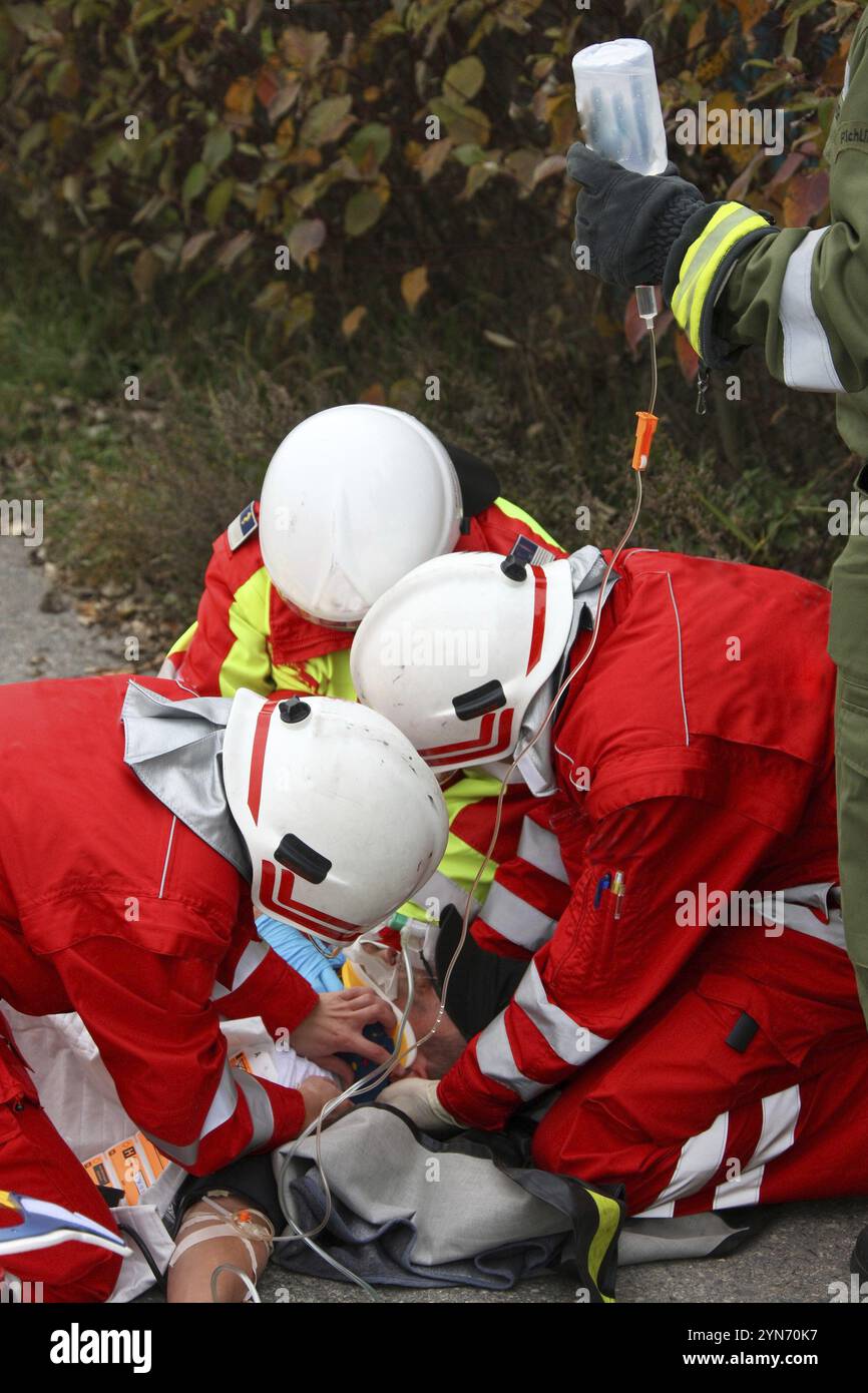 Fire brigade practising an emergency in a car accident, Resuscitation ...