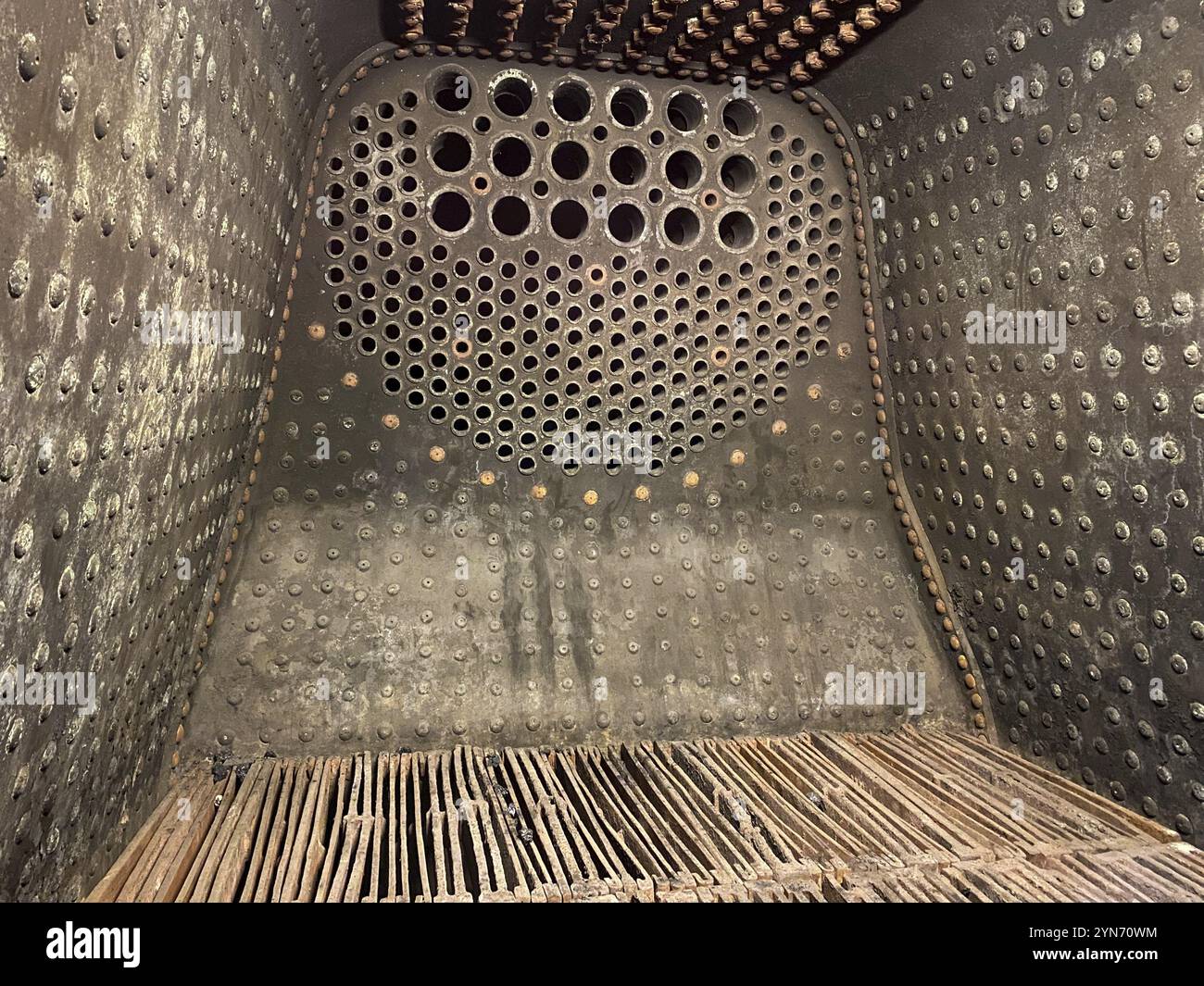 View into an old big firebox of a steam locomotive, inputs to the ...