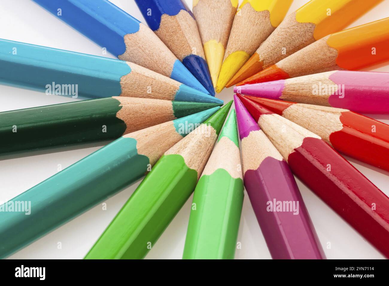 Many different coloured pencils on a white background. Studio shot ...