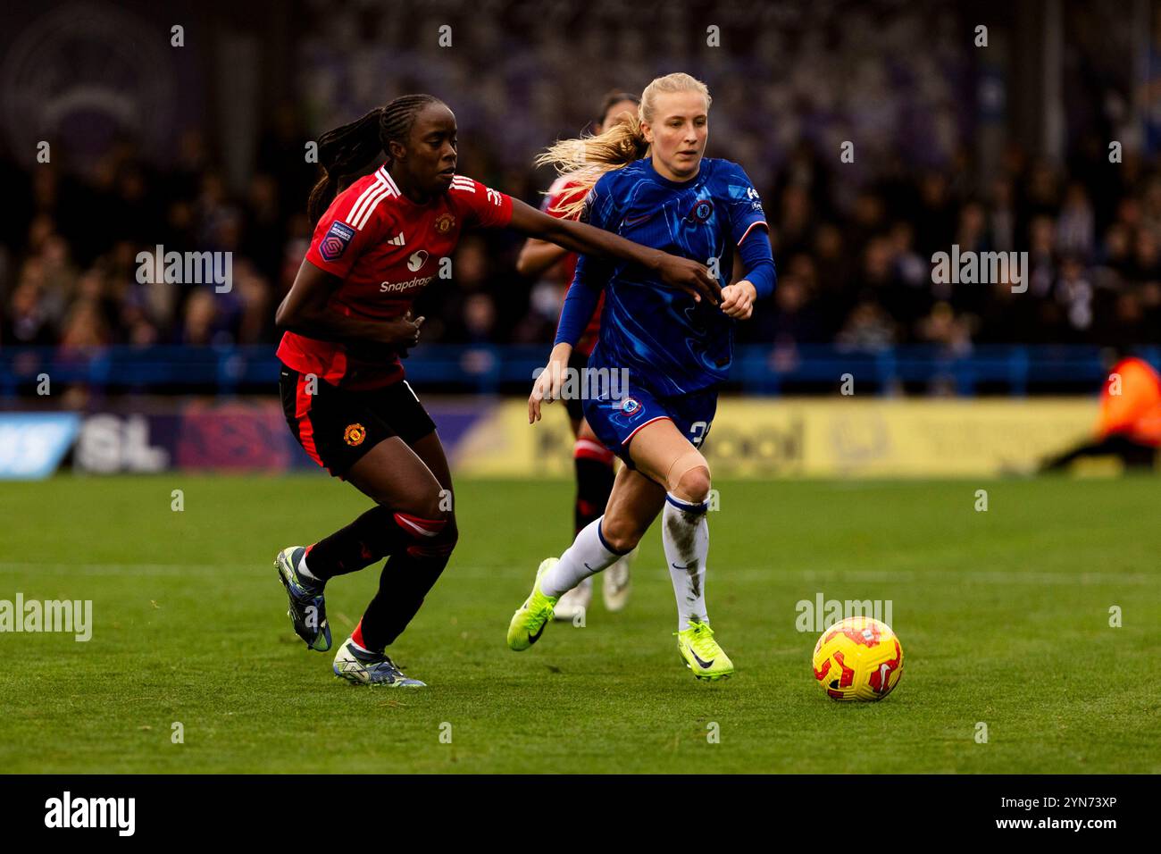 Manchester United midfielder Simi Awujo in action with Chelsea forward ...
