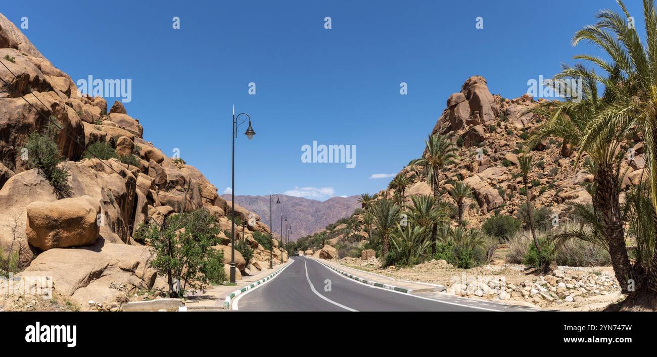 Driving through the scenic Tafraoute valley in the Anti-Atlas mountains ...