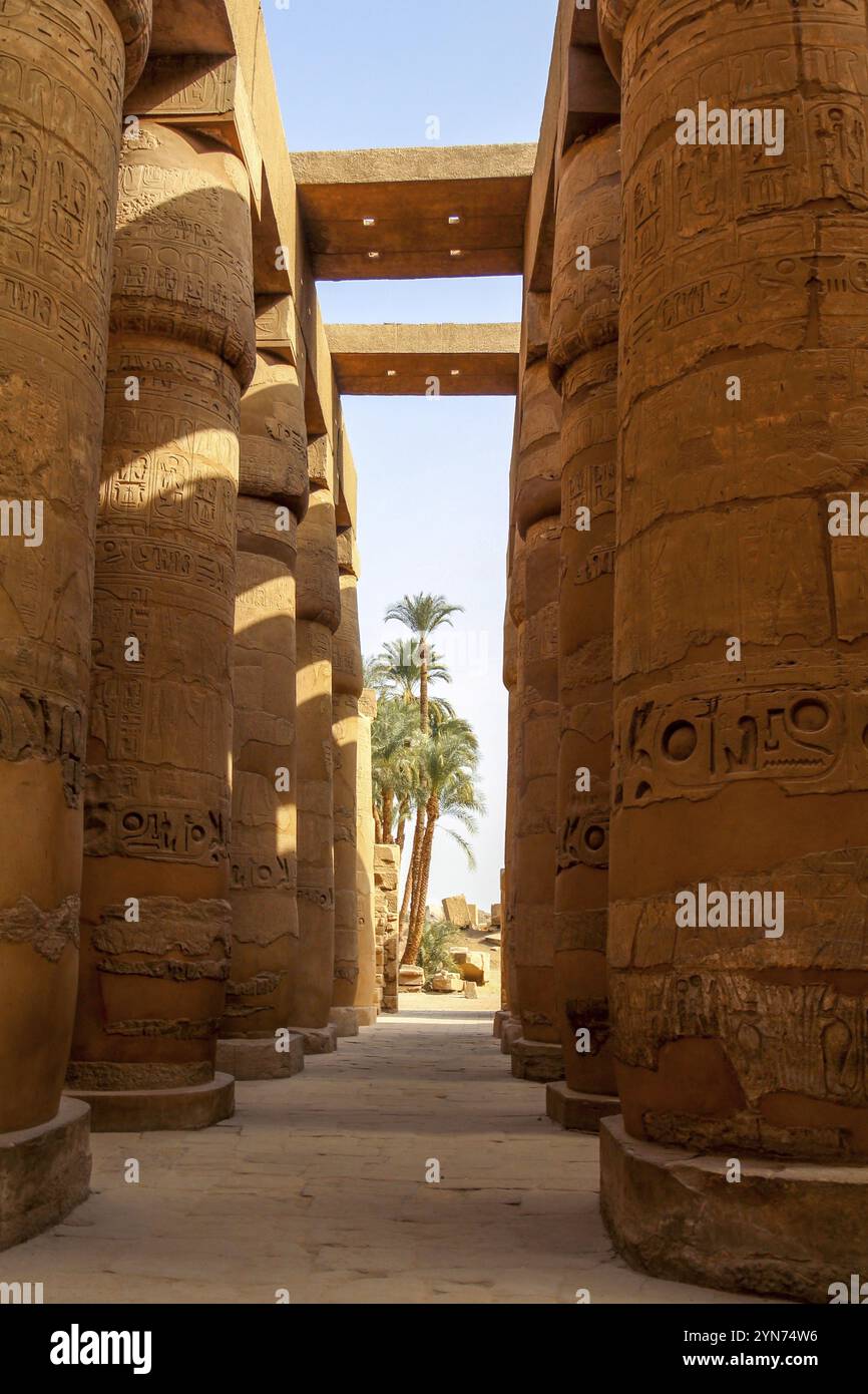 View through the majestic columns of Karnak temple through a gate ...
