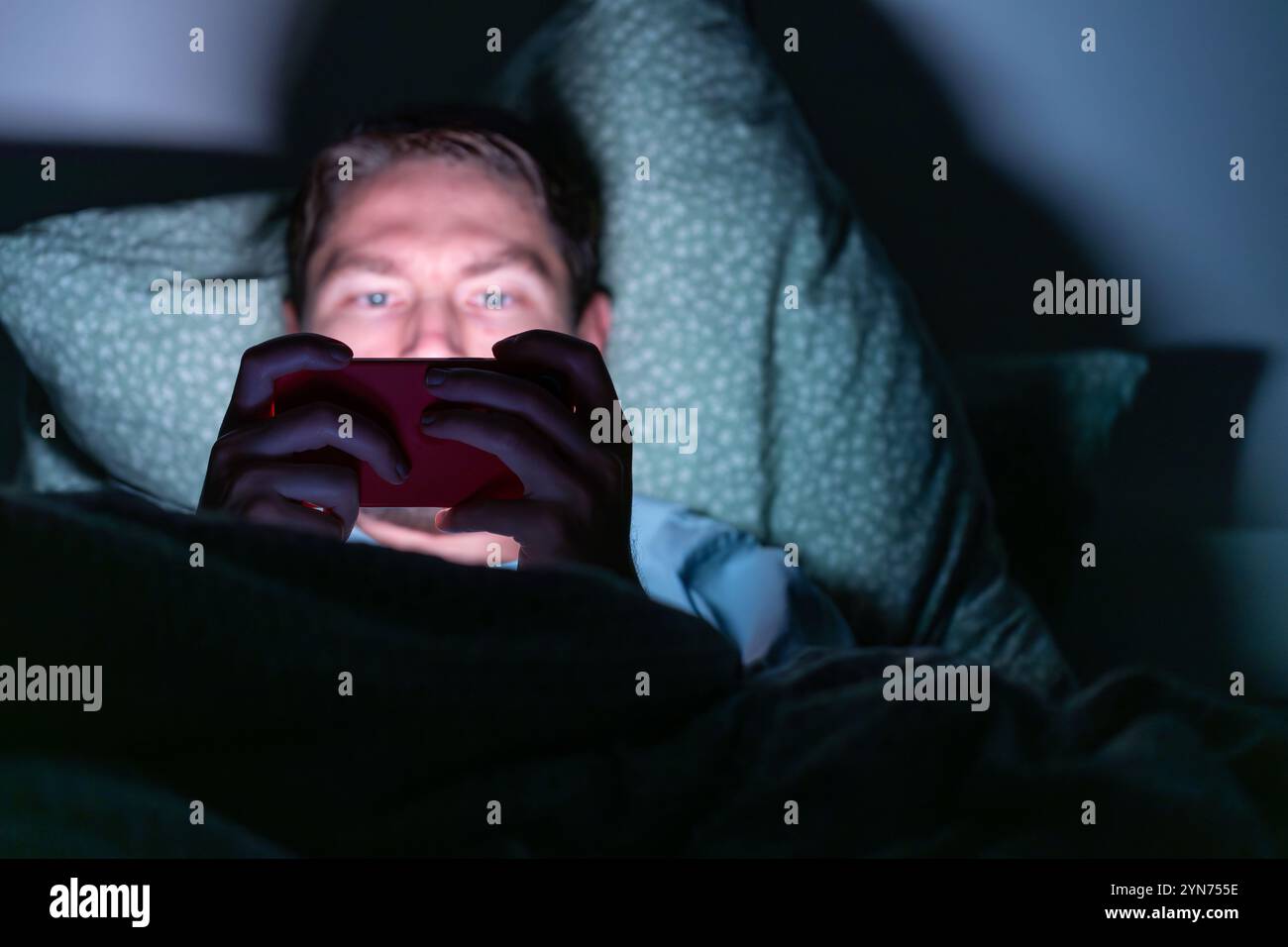 person using phone in bed, using phone before sleep. phone device ...