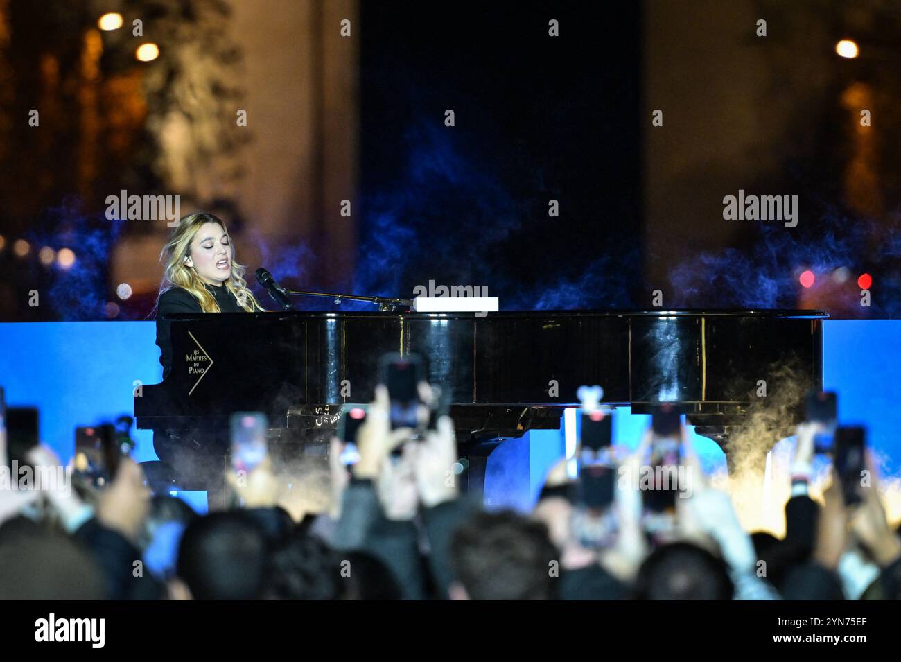 French singer Santa performs during the Champs Elysees Christmas Lights ...