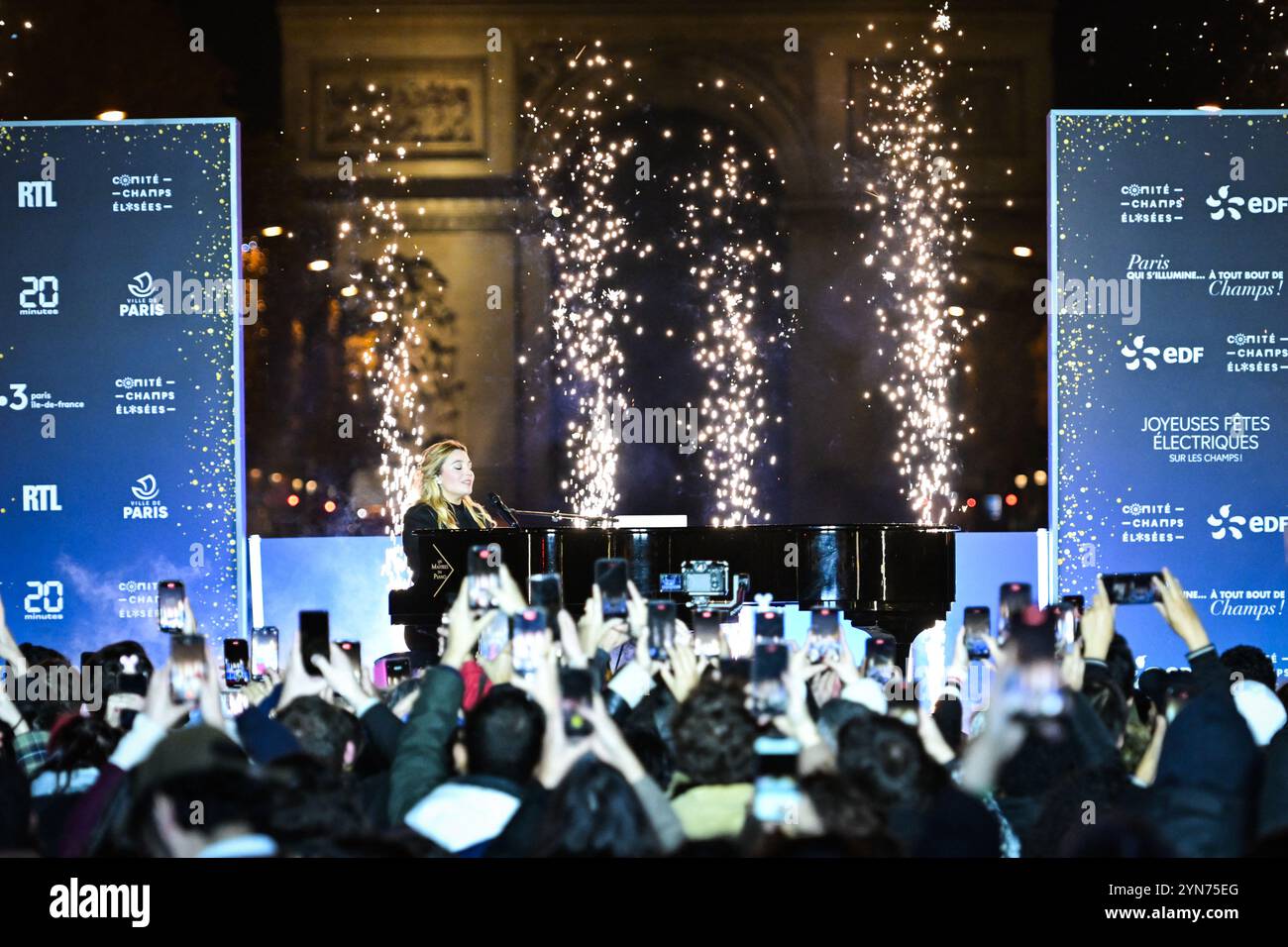 French singer Santa performs during the Champs Elysees Christmas Lights ...