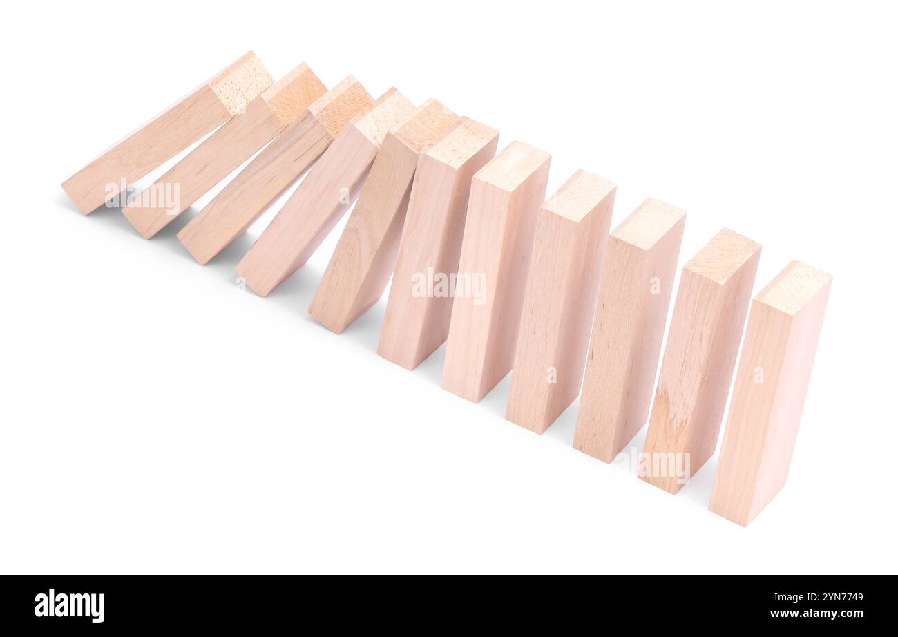 Domino effect. Wooden blocks falling on white background Stock Photo ...