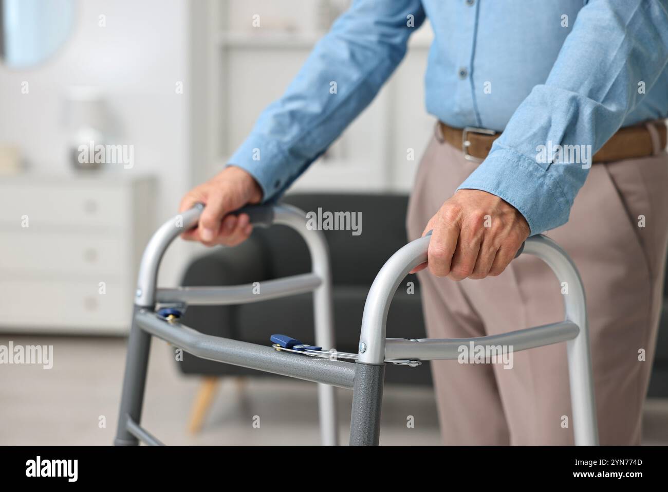 Person with walker at home closeup hi-res stock photography and images ...