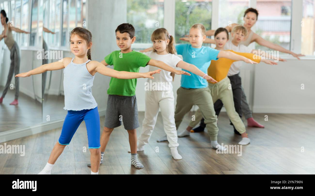 Group children warm up before hi-res stock photography and images - Alamy
