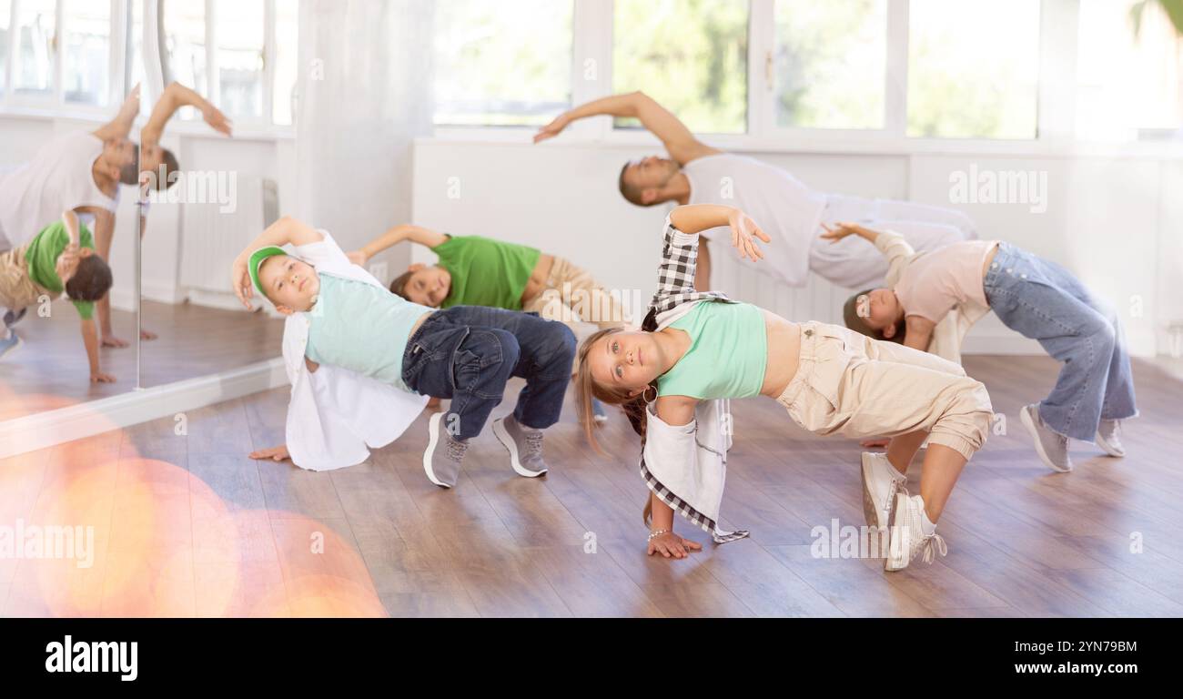 Tween girl dancer rehearsing krump dance at group workout Stock Photo ...