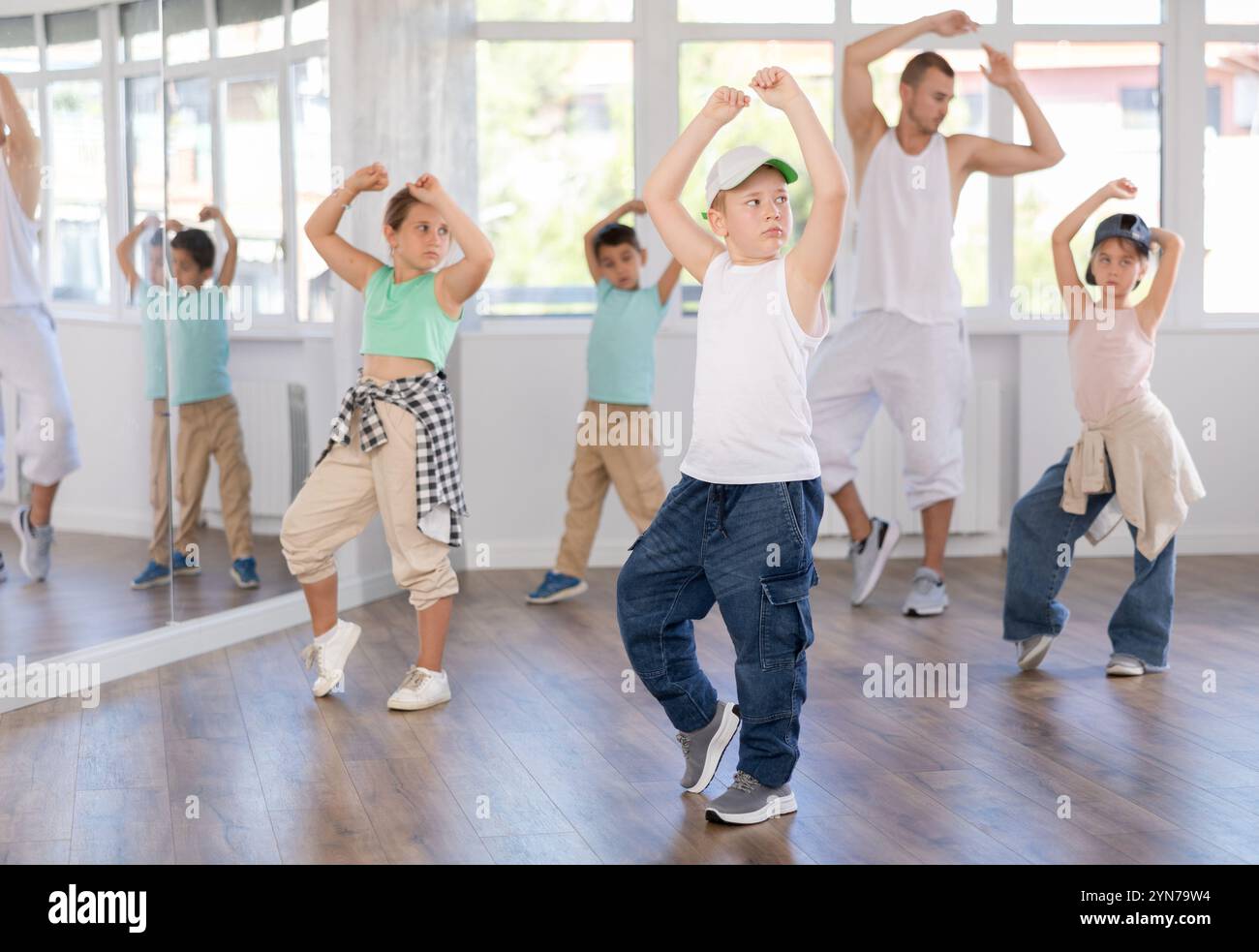 Preteen boy doing hip hop dance during group class Stock Photo - Alamy