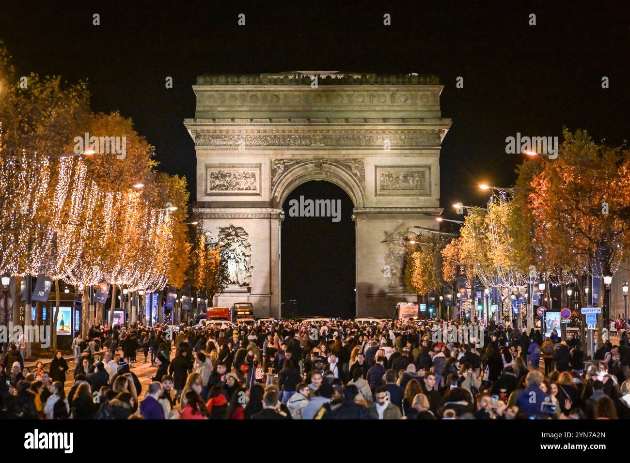 Christmas enthusiasts attend the Champs Elysees Christmas Lights ...