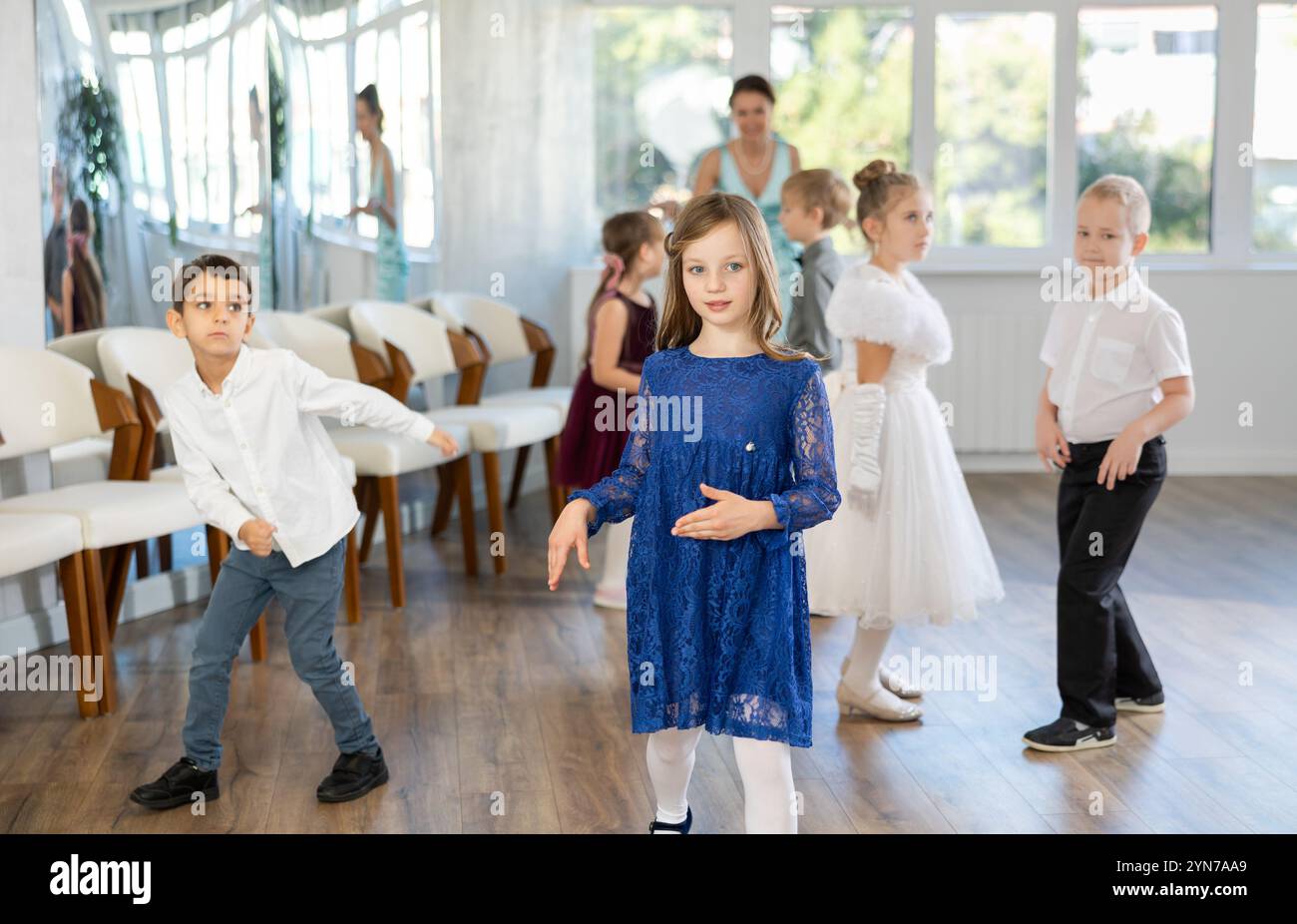 Tween girl performing twist dance during children festive event Stock ...