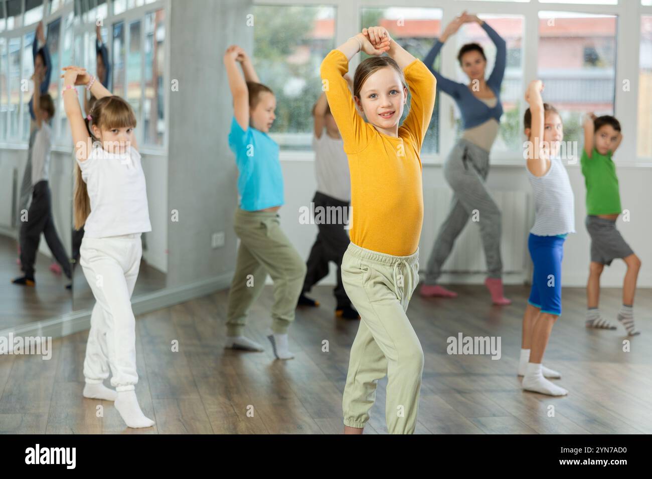 Woman dancing children indoors hi-res stock photography and images - Alamy