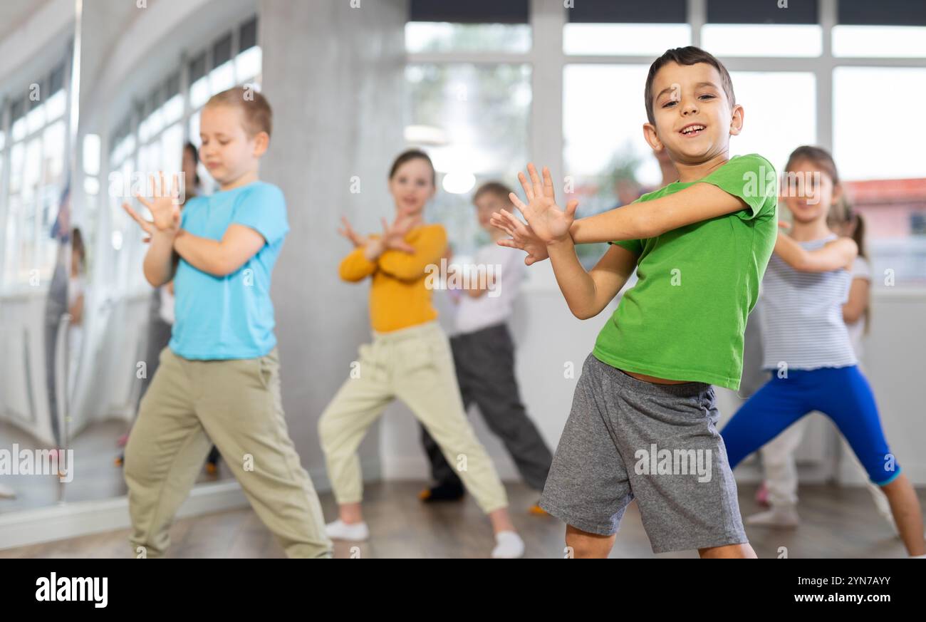 Boy learn to dance modern dances, repeat movement with unrecognizable ...