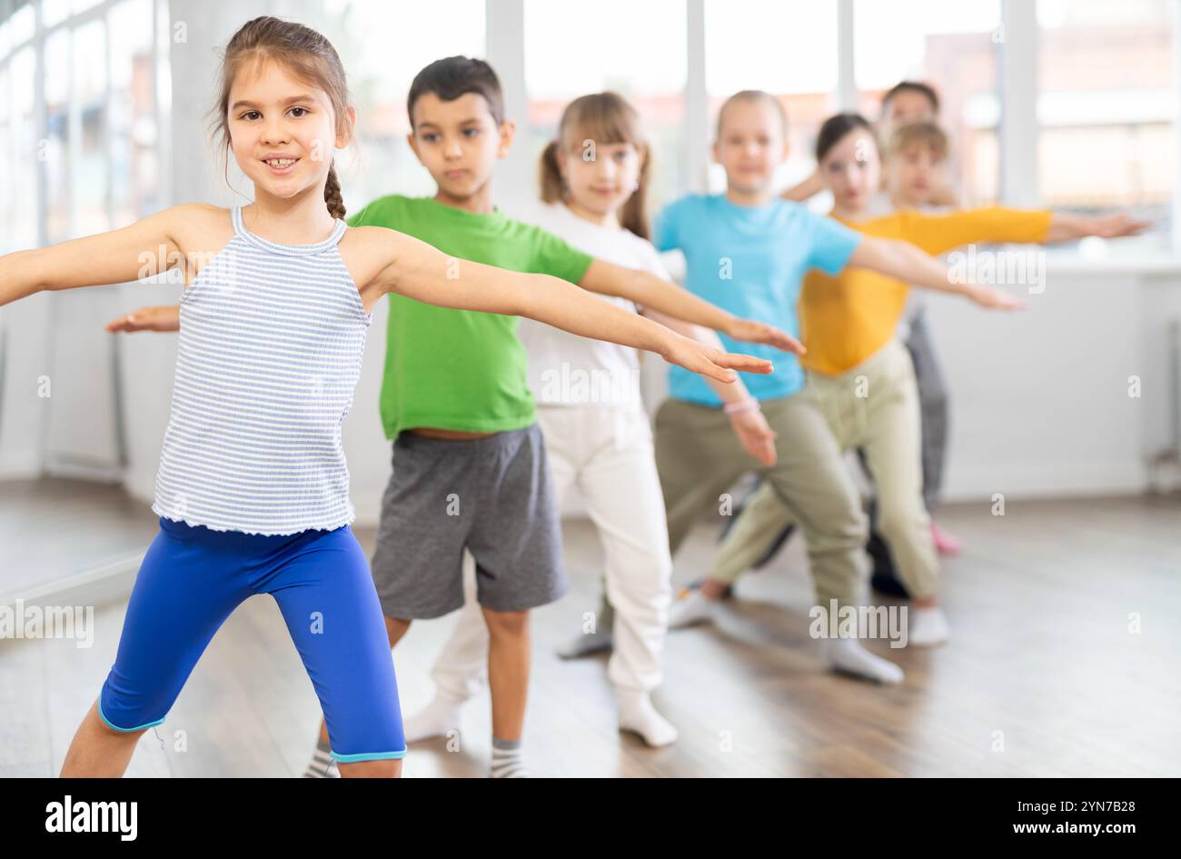 Group of children warming up before dance class Stock Photo - Alamy