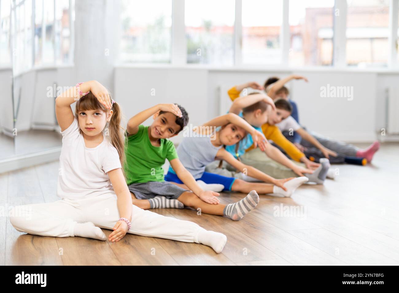 Group children warm up before hi-res stock photography and images - Alamy