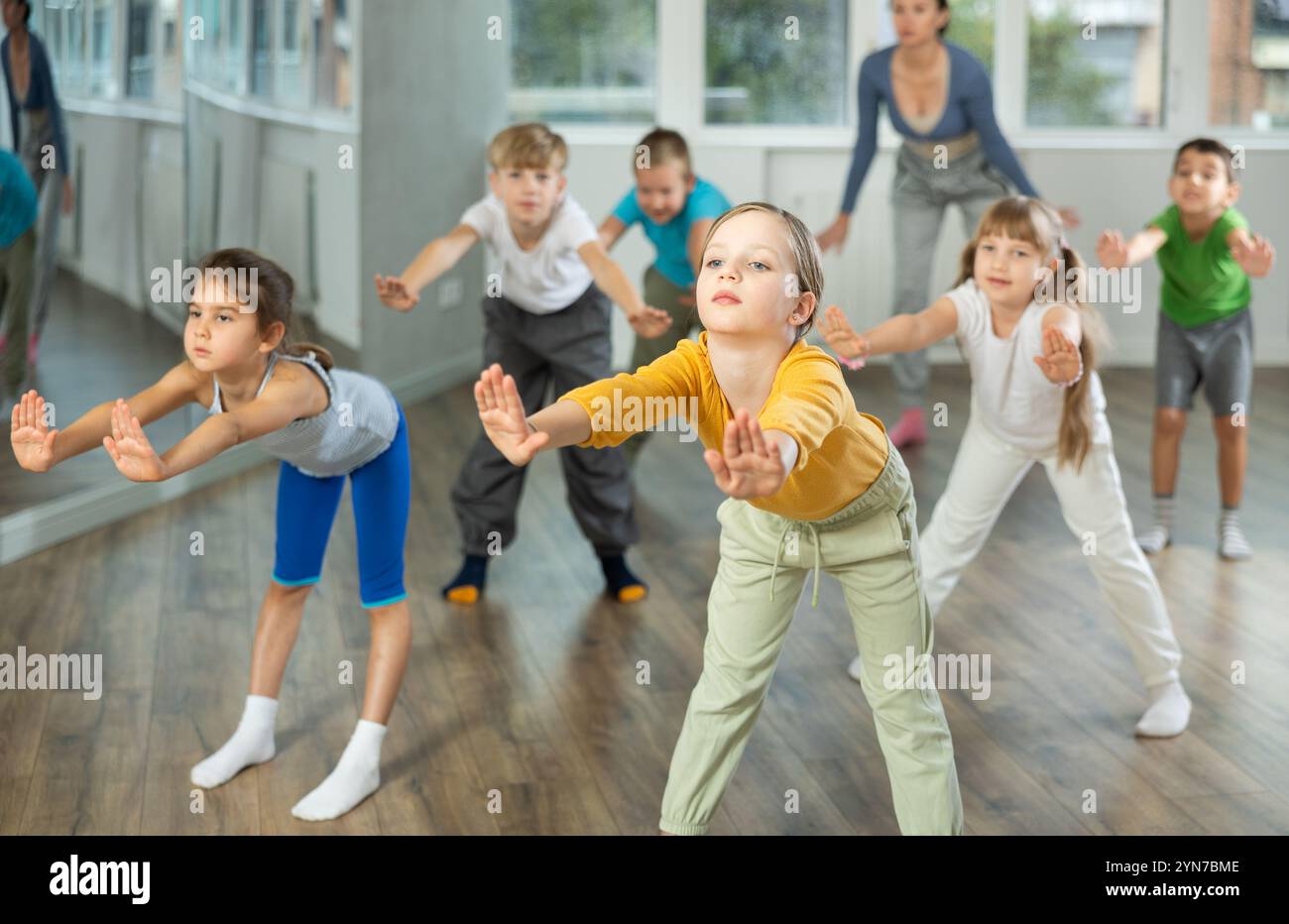 Group of children warming up before dance class Stock Photo - Alamy