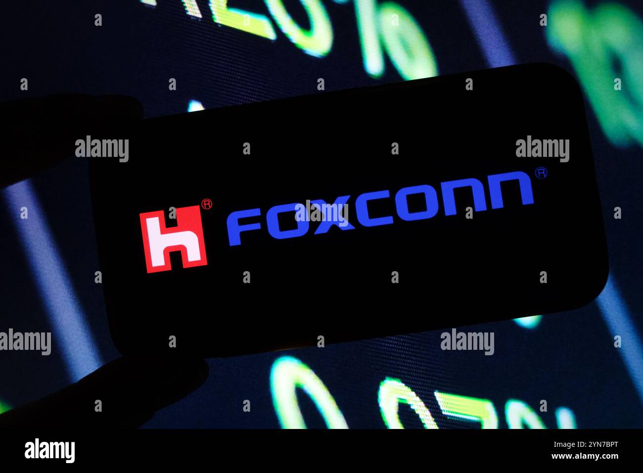 In this photo illustration, the Foxconn company logo is seen displayed ...