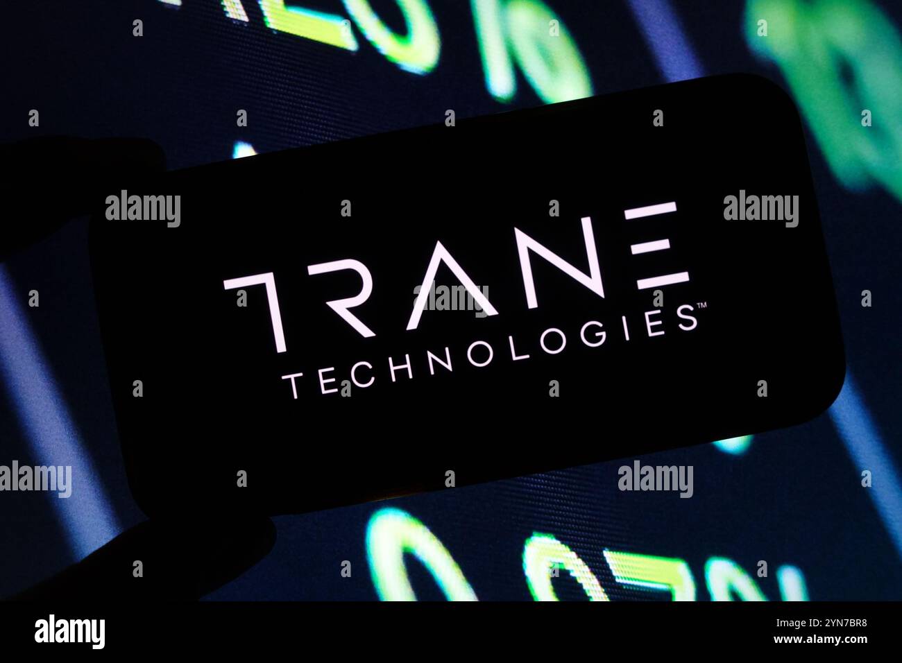 In this photo illustration, the Trane Technologies company logo is seen ...