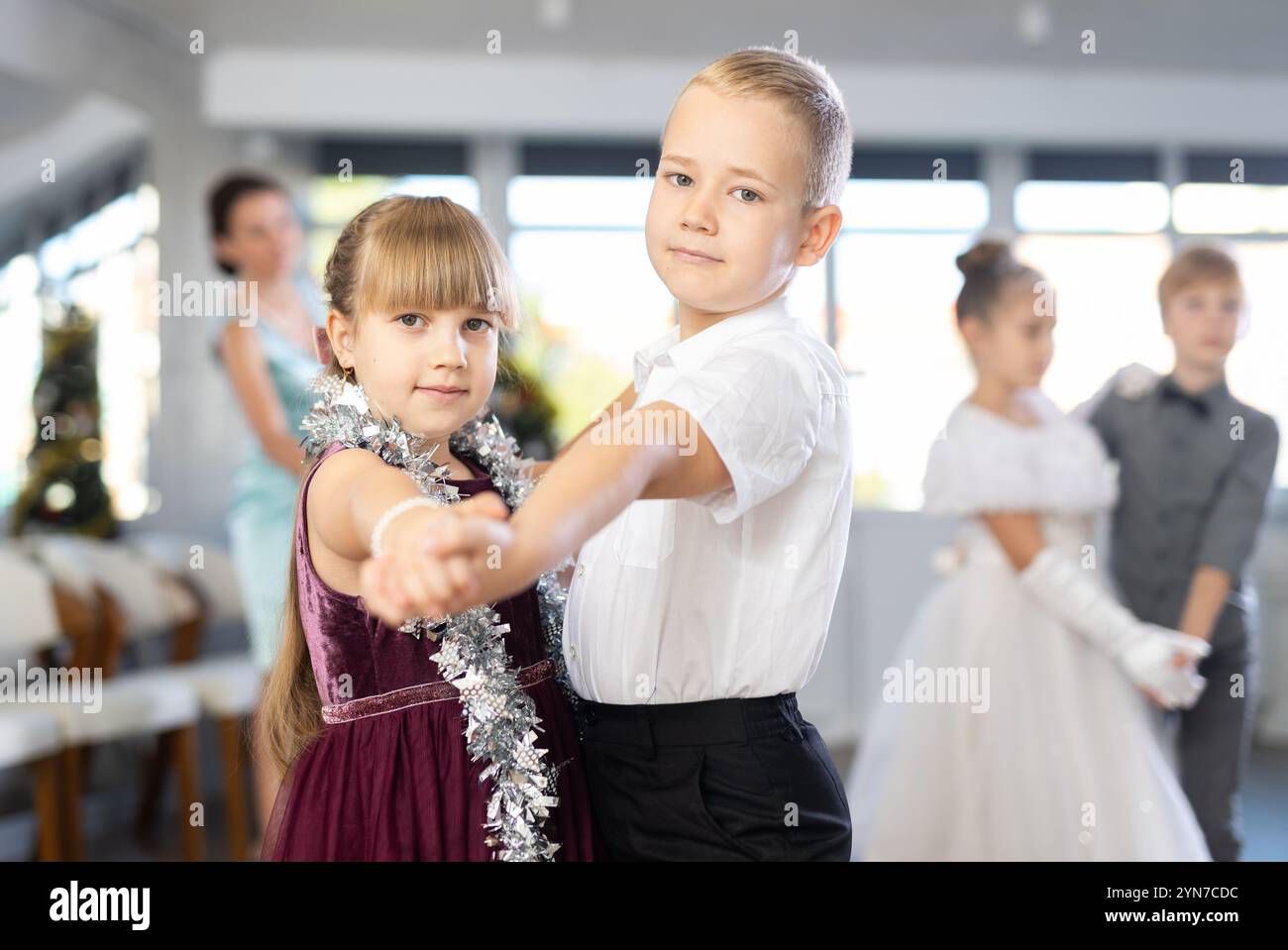 Children rehearsing ballroom dance for upcoming Christmas party at ...